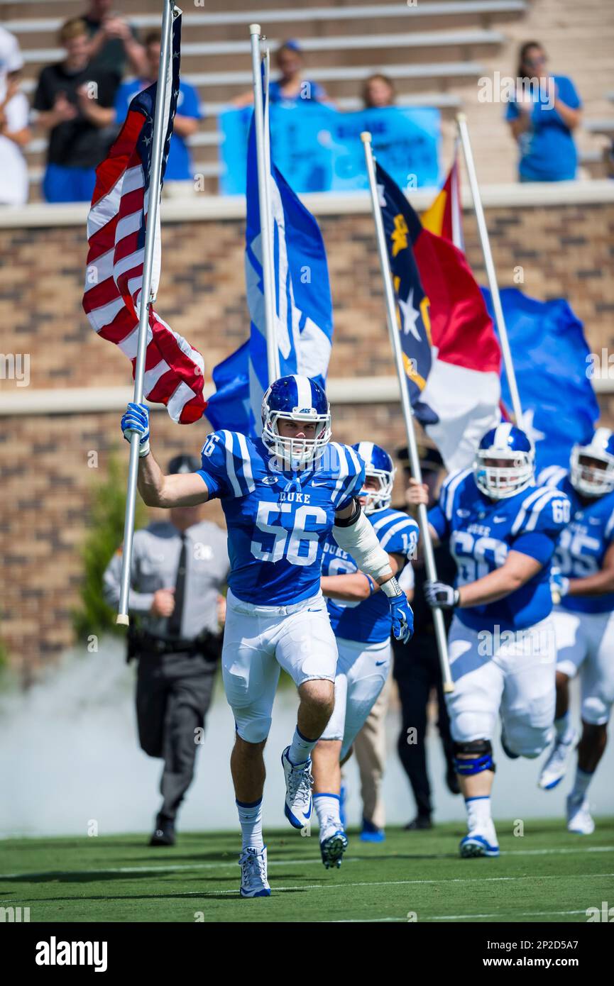 The Duke football team enters the field before the kickoff of the NCAA ...