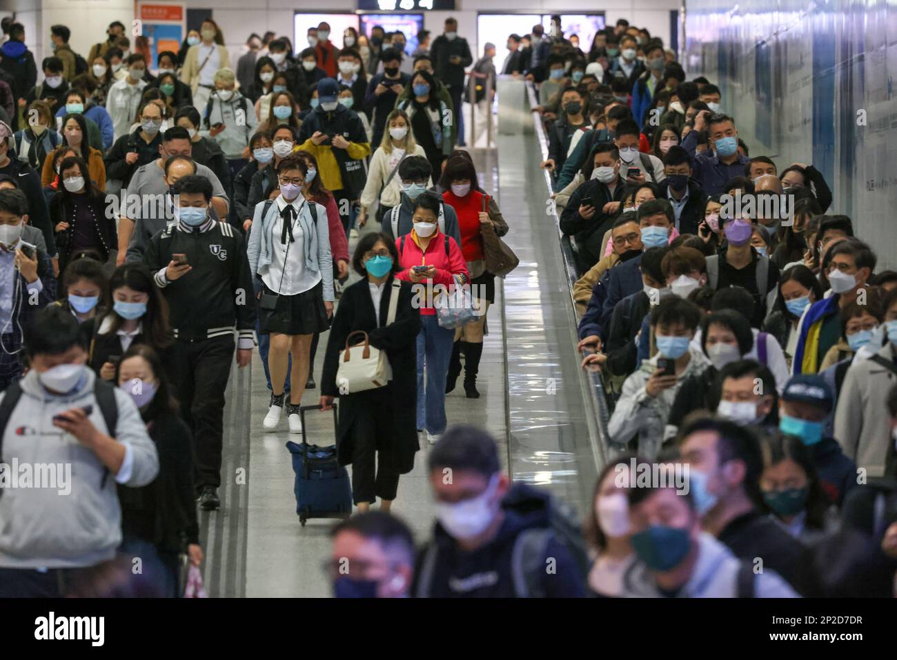 Commuters walking through the MTR station of the business district in ...