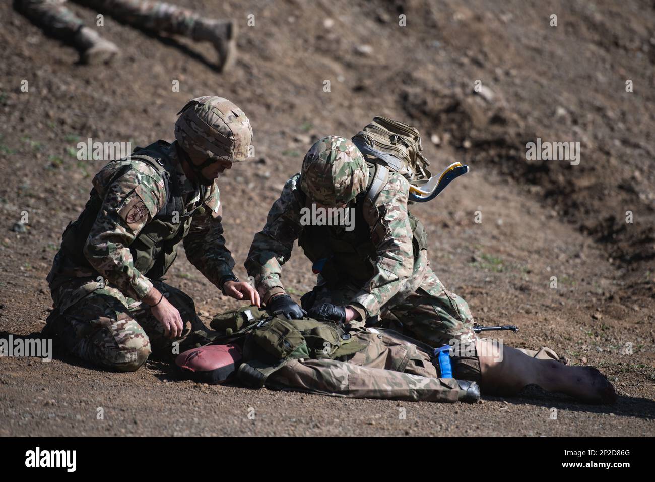 Cypriot troops with the 20th Armored Brigade treat a simulated casualty ...