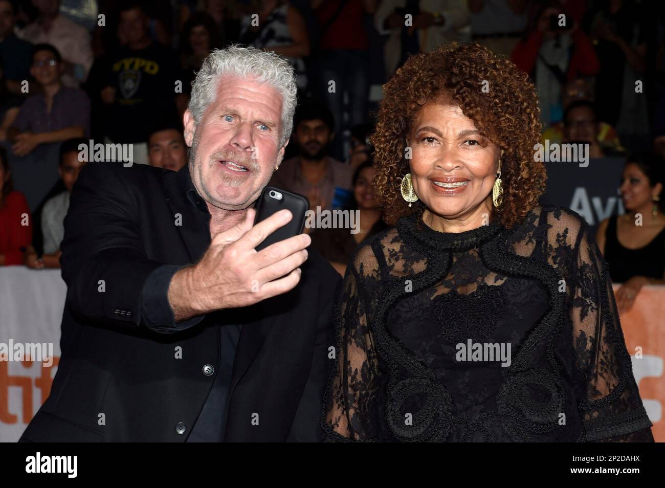 Ron Perlman takes a selfie with his wife Opal Stone as they arrive on ...