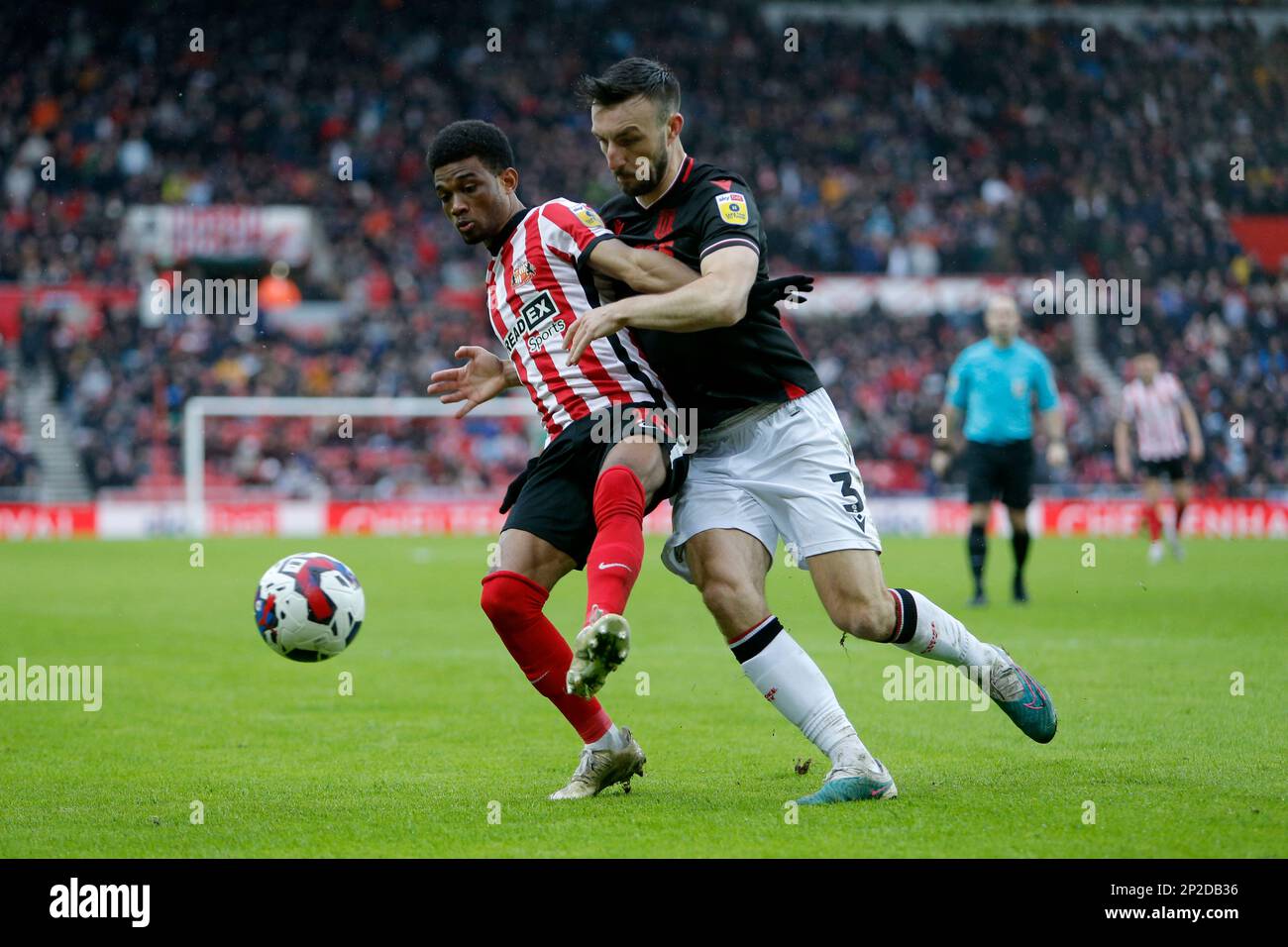 Sunderland’s Amad Diallo (left) and Stoke City’s Morgan Fox battle for ...