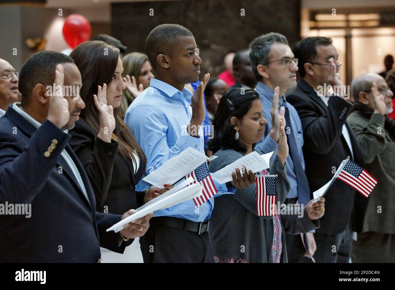 In a Sept. 11, 2015 photo, new citizens are sworn in during a ...