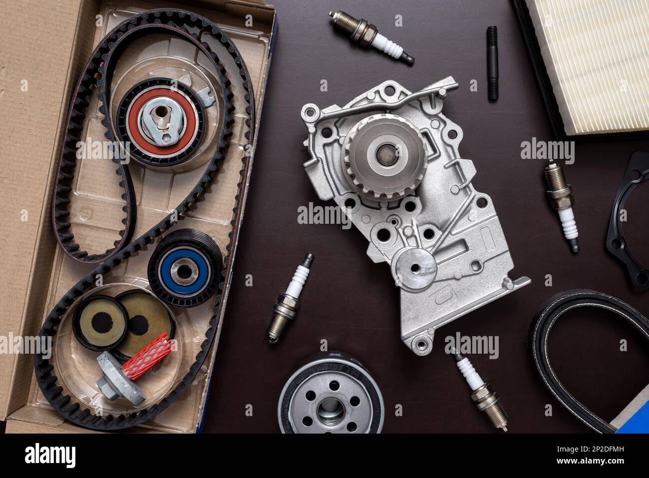 Repair kit for replacing the timing belt in a open cardboard box and ...