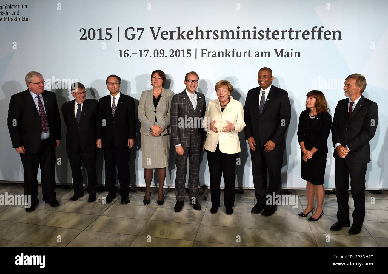 German Chancellor Angela Merkel, fourth from right, poses for a group ...
