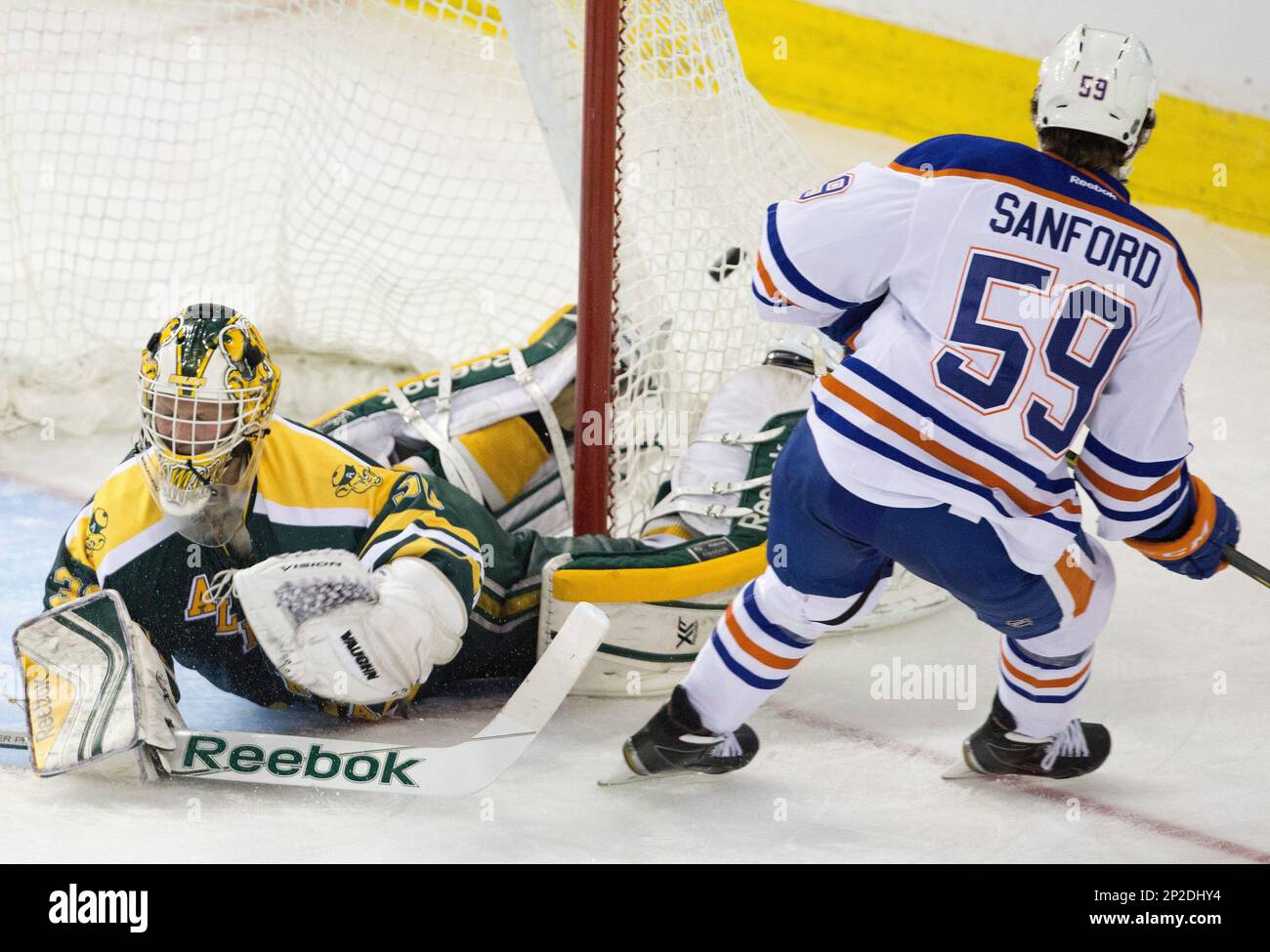 Edmonton Oilers' Cole Sanford (59) scores a goal on University of ...