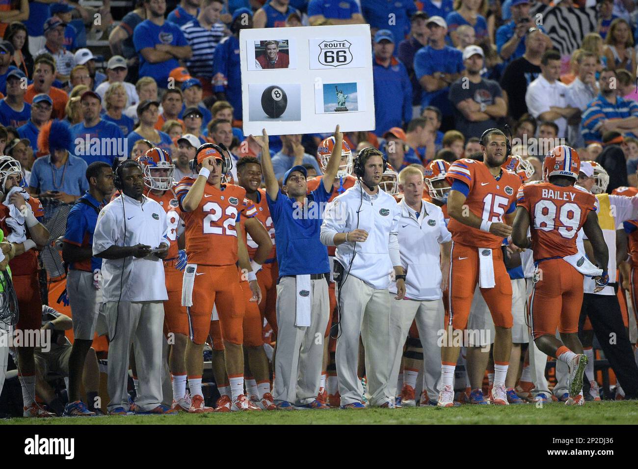 Florida assistants signal plays using poster boards from the sideline ...