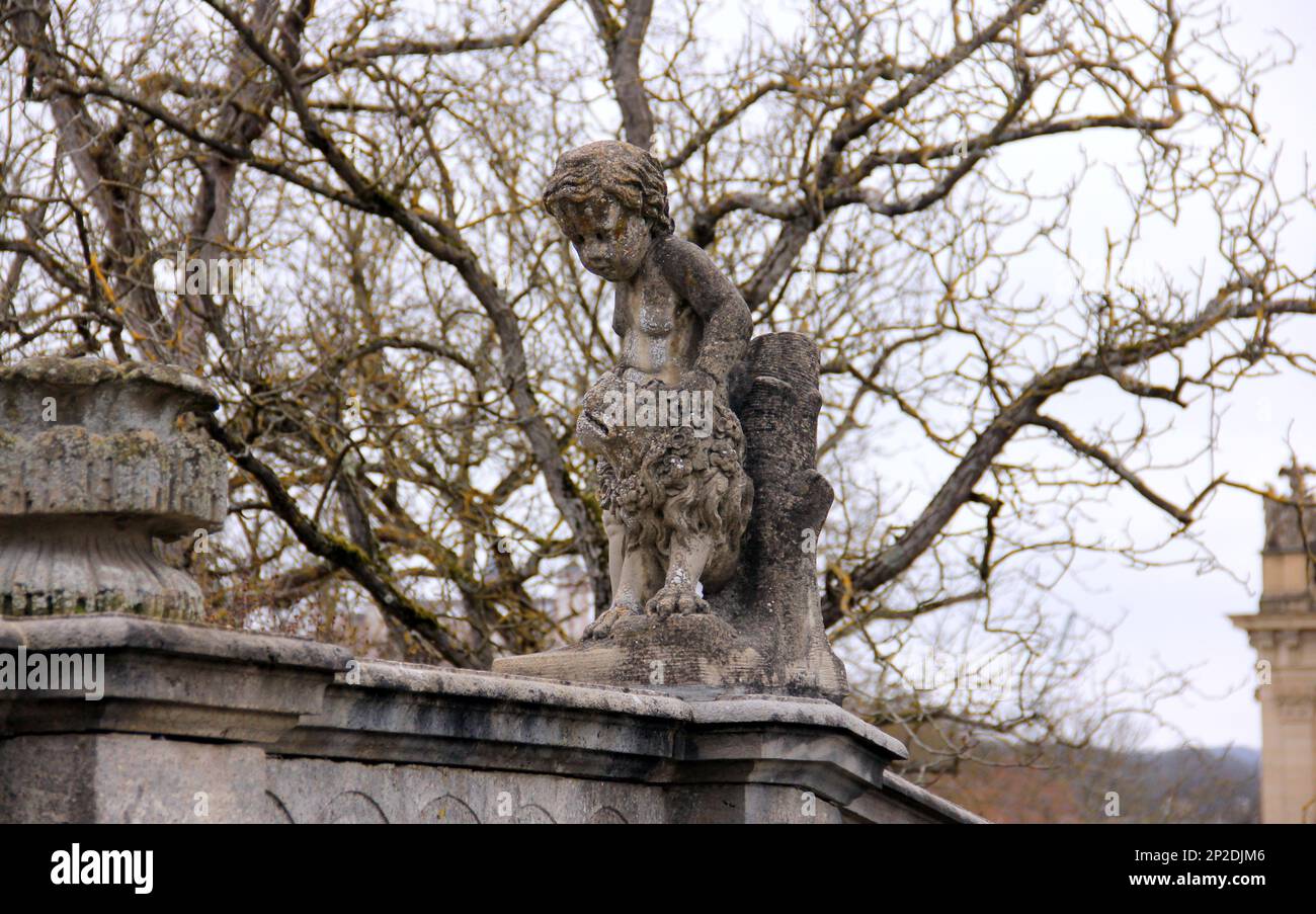 Sculpture of putto with a lion in the Court Gardens of the Residenz ...