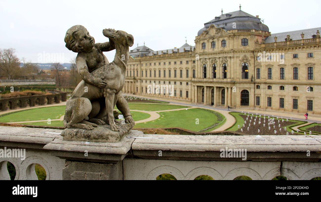 Sculpture of a putto playing with a dog, in Court Gardens of the ...