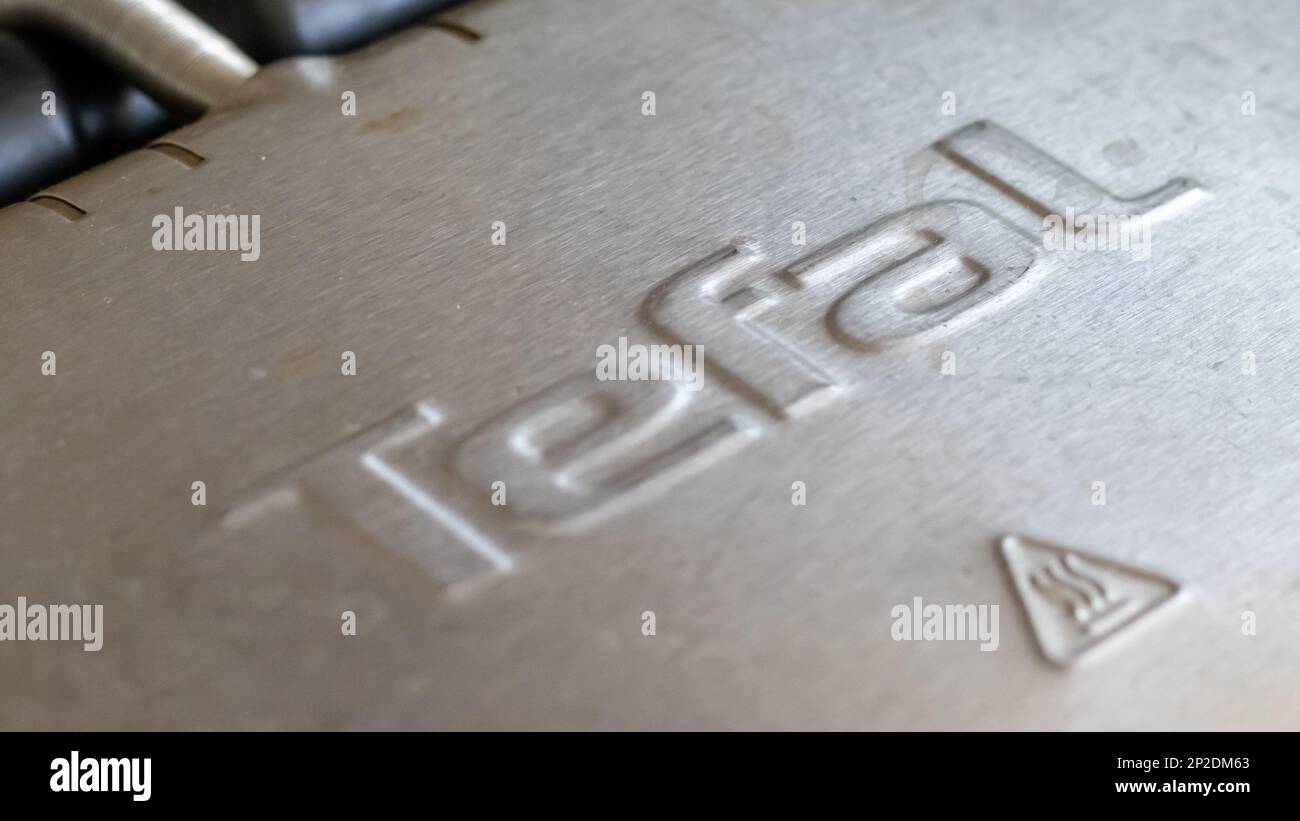 Tefal logo on electric grill. Stainless steel, special non-stick ...