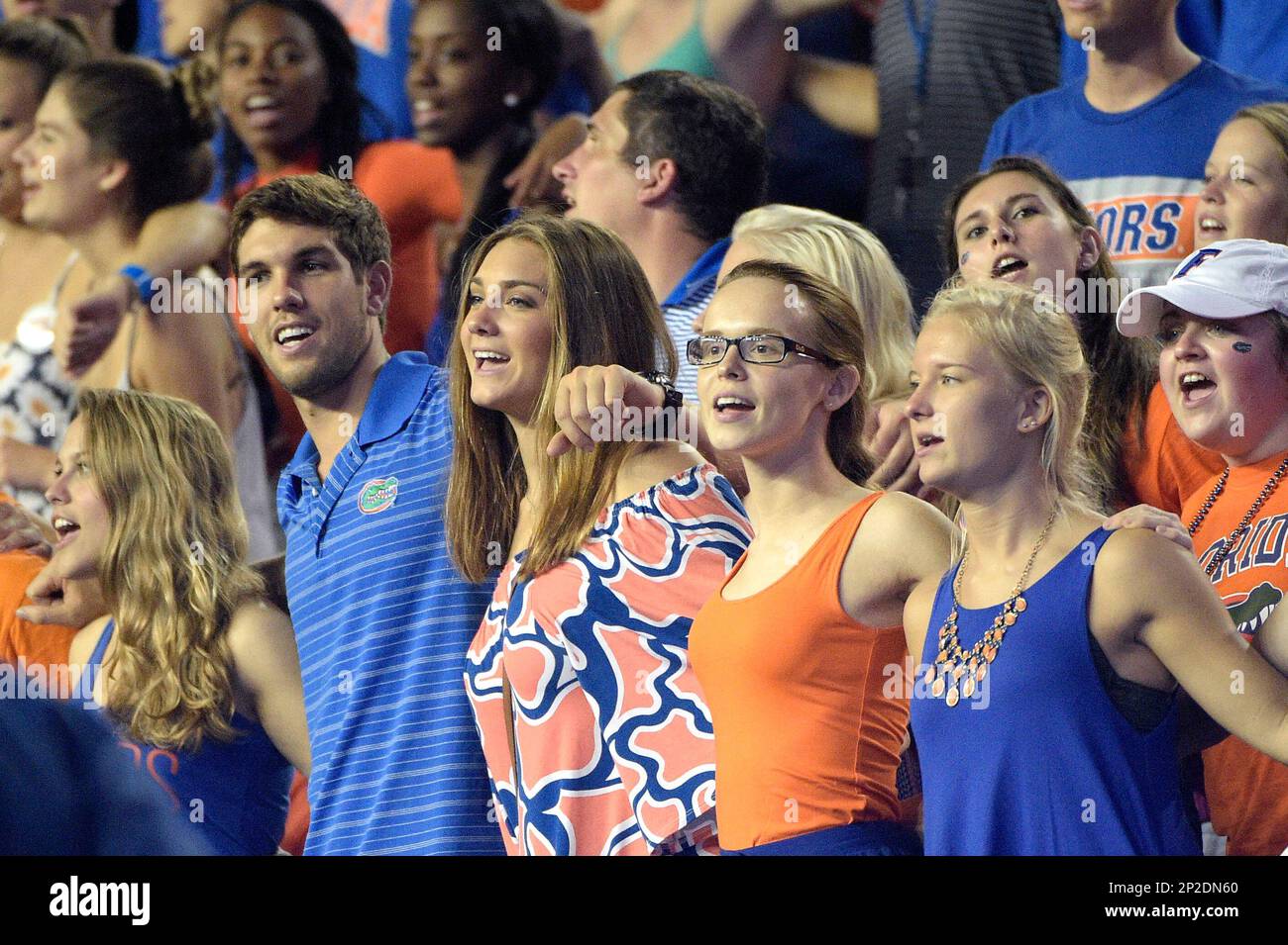 Florida fans sing together in the stands during the second half of an ...