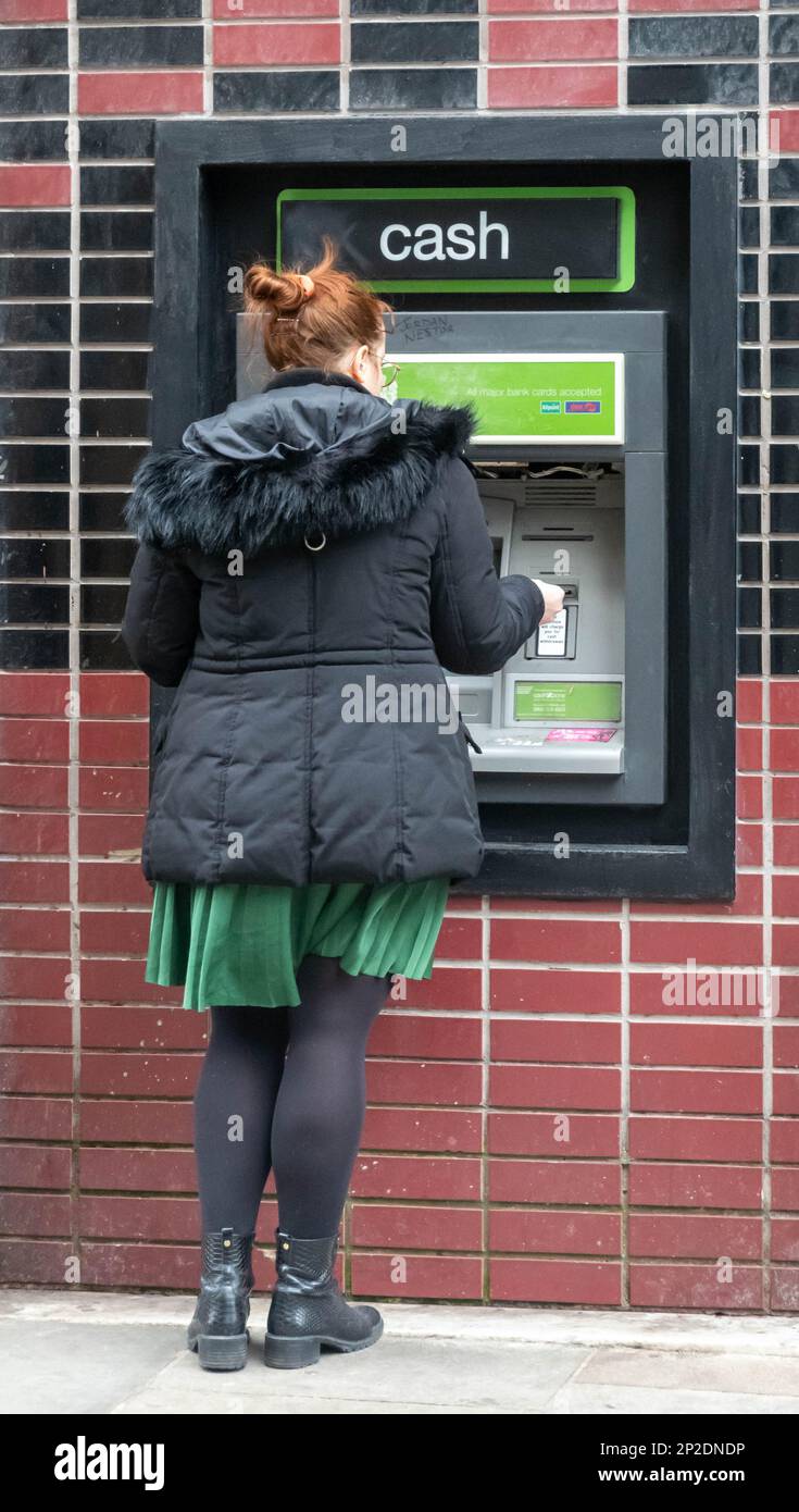 Using the cash machine hi-res stock photography and images - Alamy