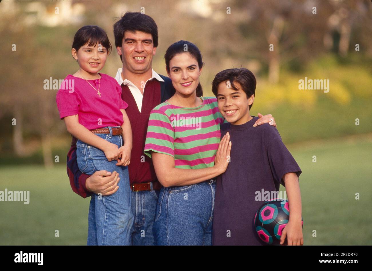 Hispanic Family Playing Outside