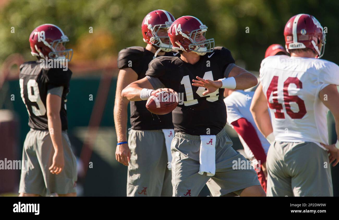 Alabama quarterback Jake Coker (14) works through drills during an NCAA ...