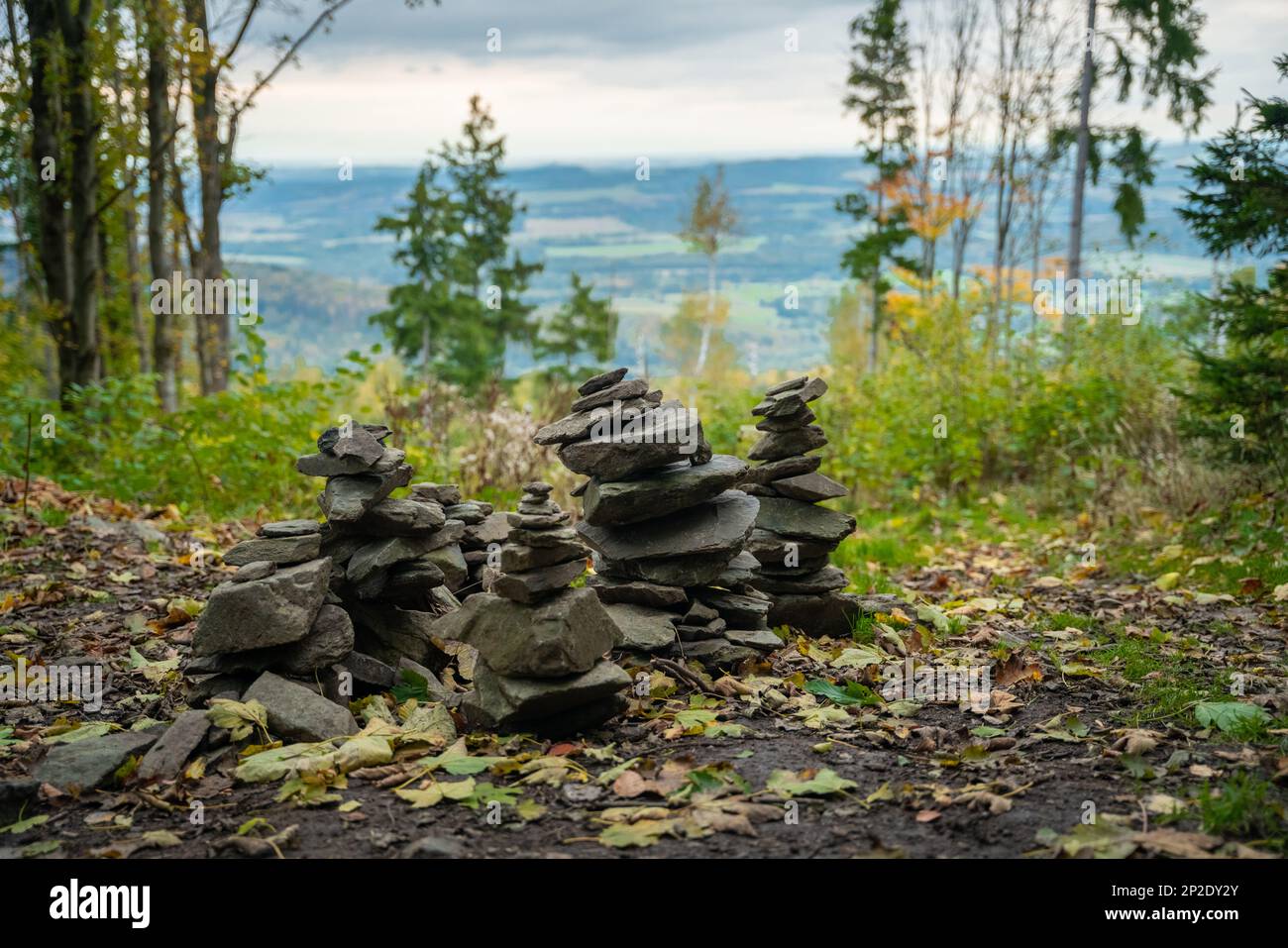 Stone pyramids lined up along the trail. Polish mountains Stock Photo ...