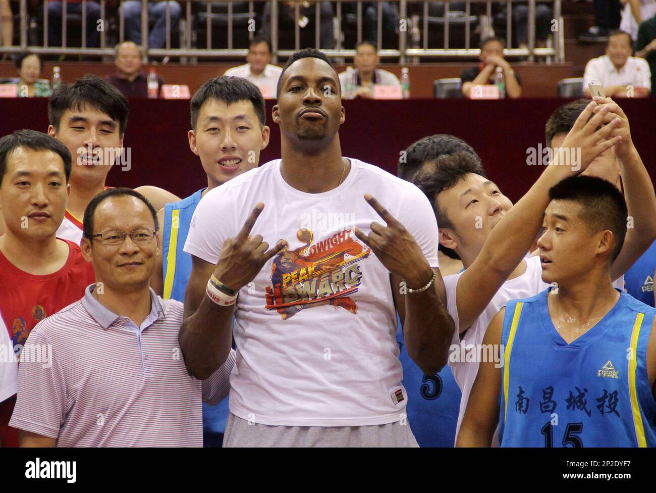 NBA star Dwight Howard, center, poses with young Chinese boys at a ...