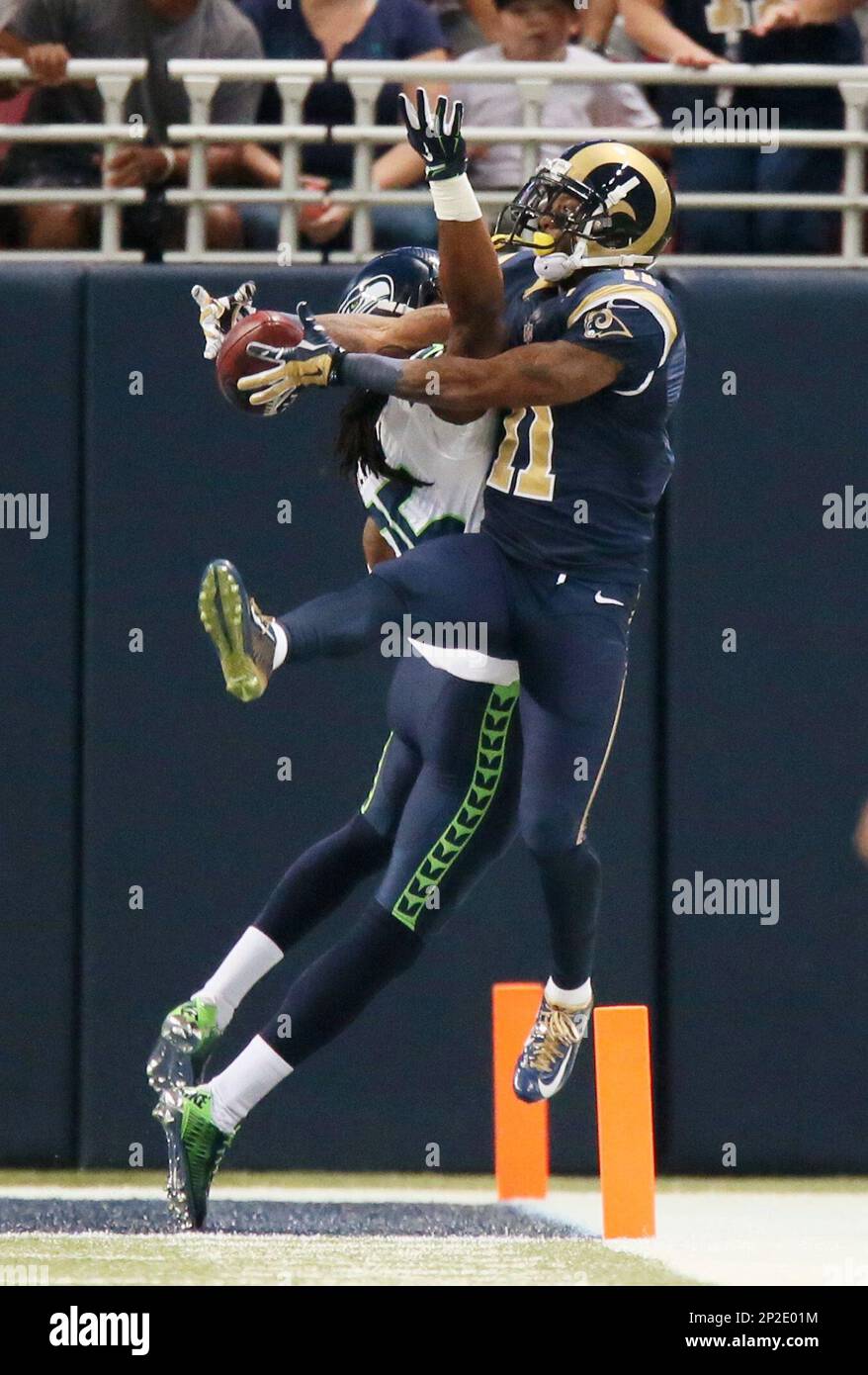 Seattle Seahawks cornerback Richard Sherman (left) breaks up a pass ...