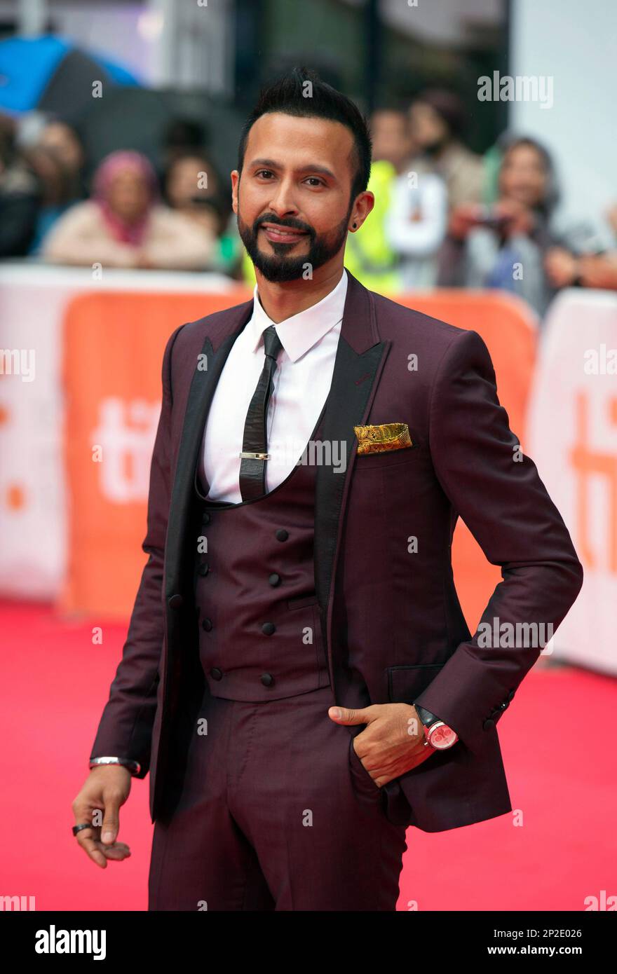 Ali Kazmi poses for photos on the red carpet at the gala for the film ...