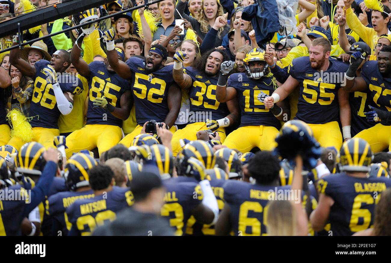 September 12, 2015: Michigan players celebrate in the student section ...
