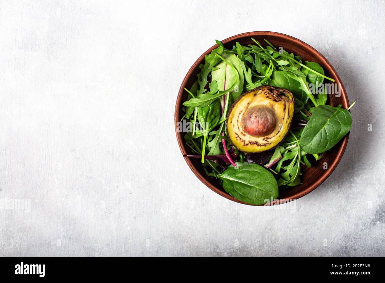 Rotten avocado, overriped, bad avocado. Half sliced fruit, freegan food ...