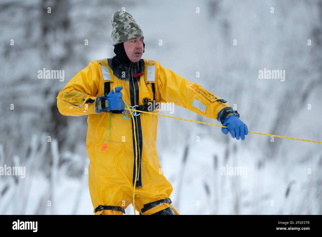 Edsel Scott, a firefighter with the 673d Civil Engineer Squadron, pulls ...