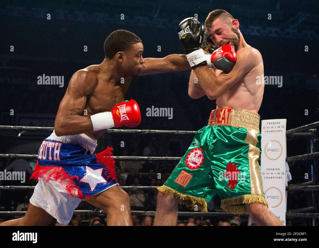Errol Spence Jr. connects to the jaw of Chris Van Heerden during their ...