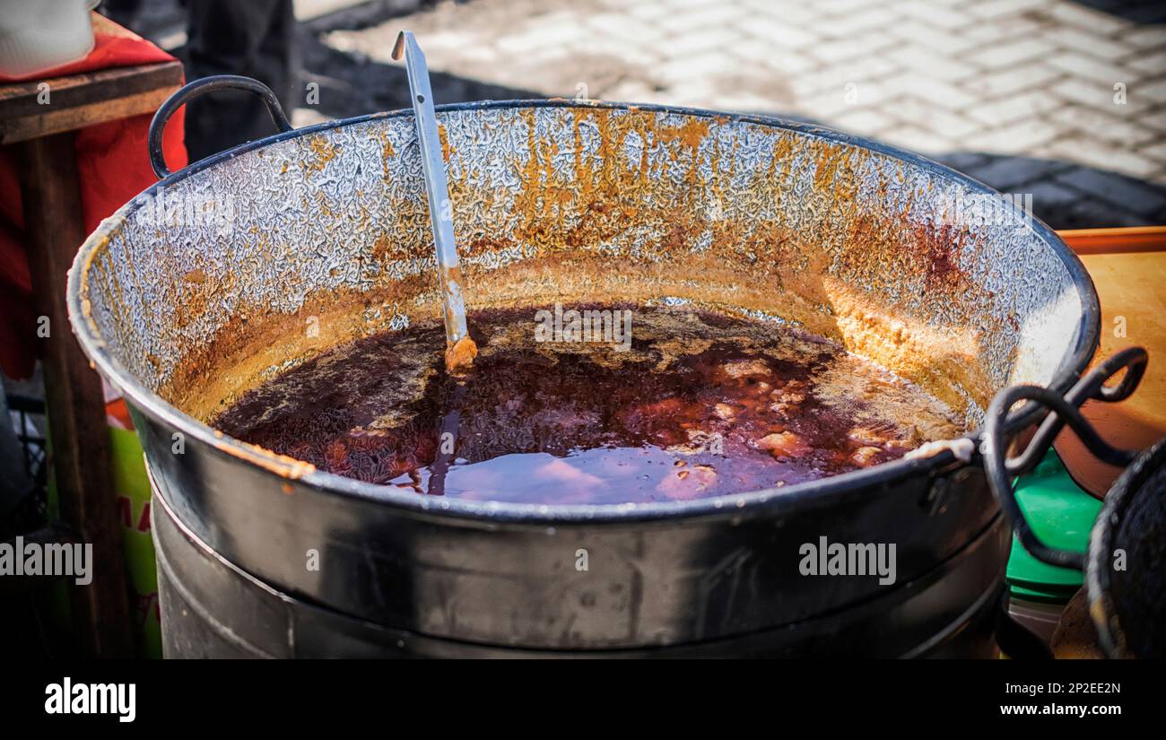 Serbian traditional stew cooked in big pots Stock Photo - Alamy