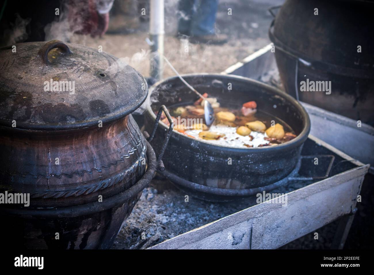 Serbian traditional stew cooked in big pots Stock Photo - Alamy