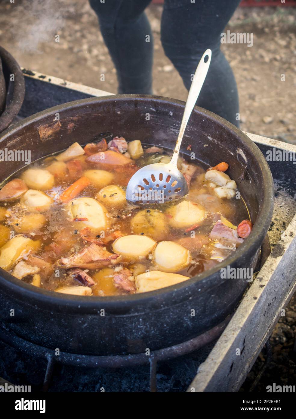 Serbian traditional stew cooked in big pots Stock Photo - Alamy