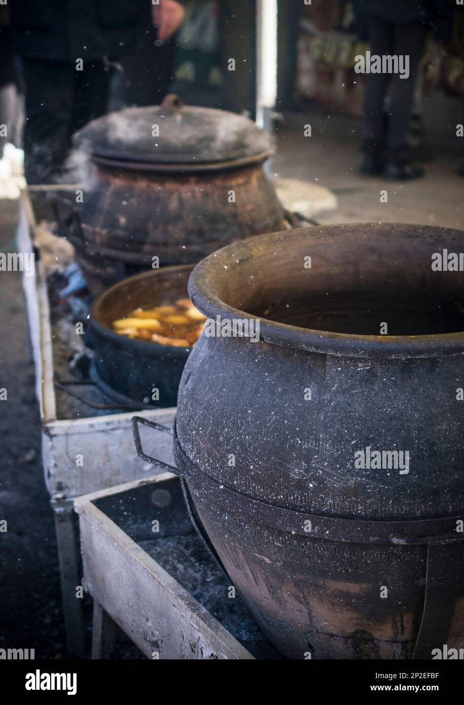 Serbian traditional stew cooked in big pots Stock Photo - Alamy