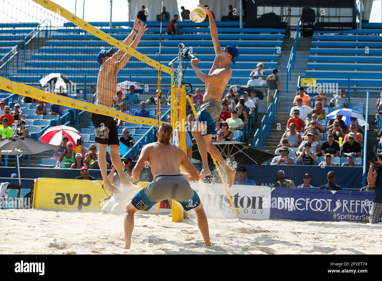 September 6, 2015: Jake Gibb (right) hits a smash as Tri Borne defends ...