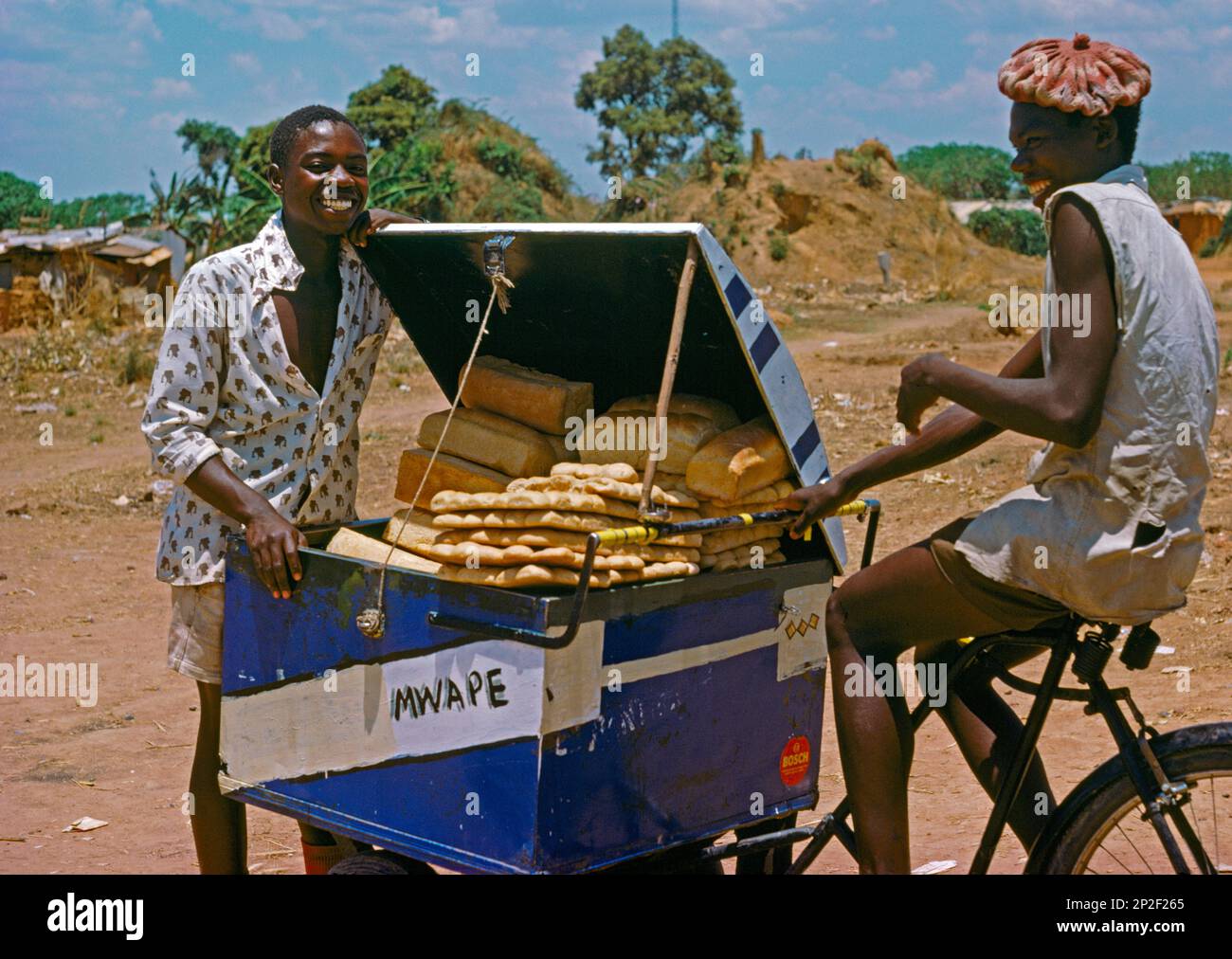 Zambia Man Selling Bread from Bicycle Laughing Stock Photo - Alamy