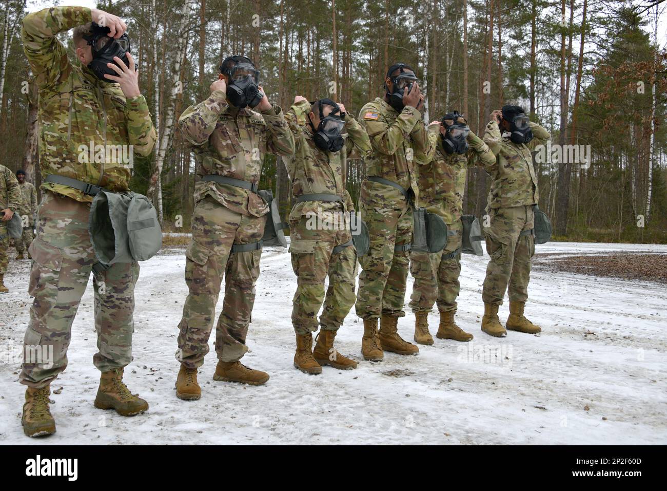 U.S. Soldiers with 207th Military Intelligence Brigade apply their gas ...