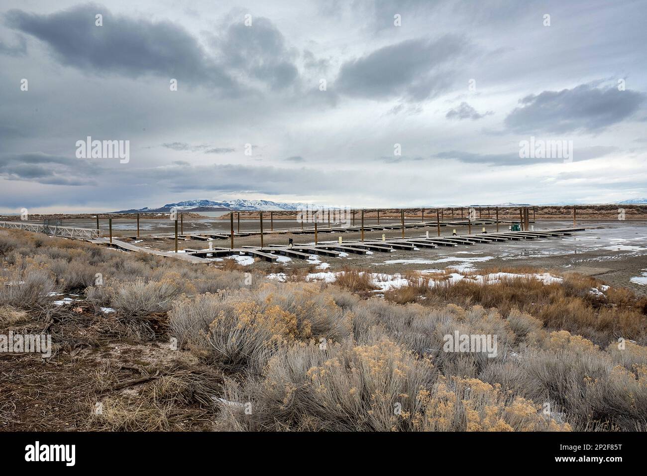 February 28, 2023: An abandoned marina along the receding shoreline of ...