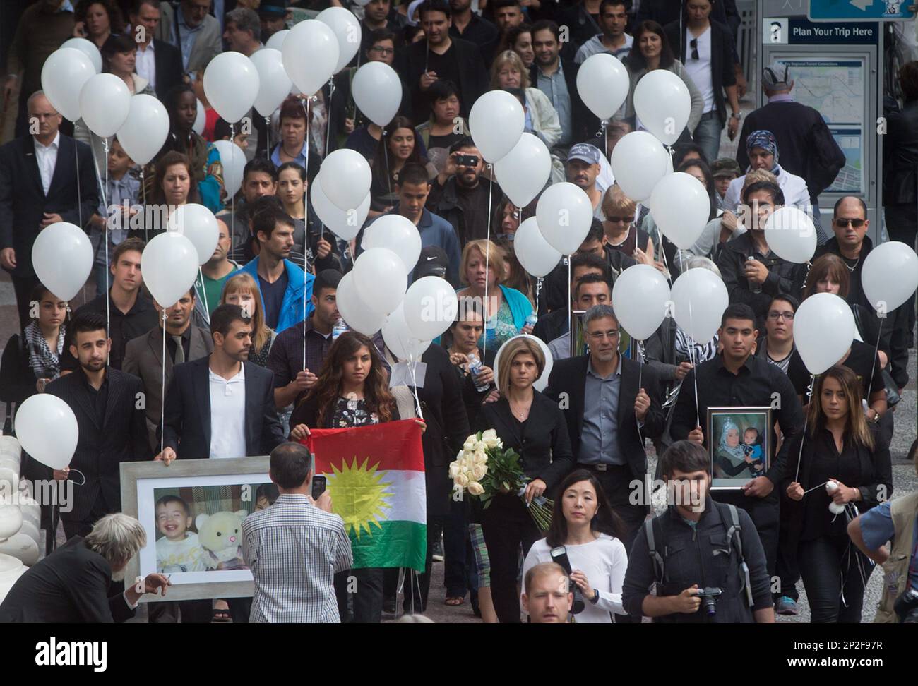 Tima Kurdi, center carrying flowers, aunt of late brothers Alan and ...