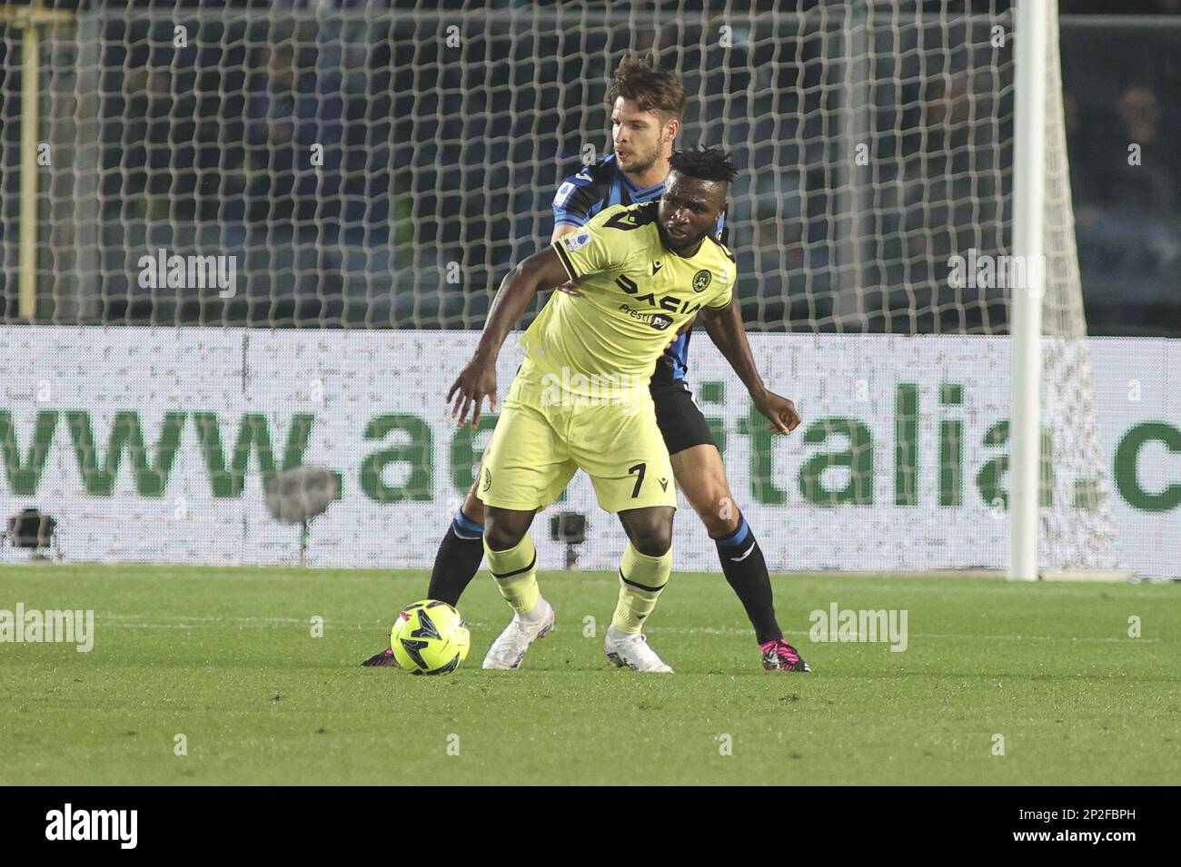 Isaac Success of Udinese FC competes for the ball with Berat Djimsiti ...