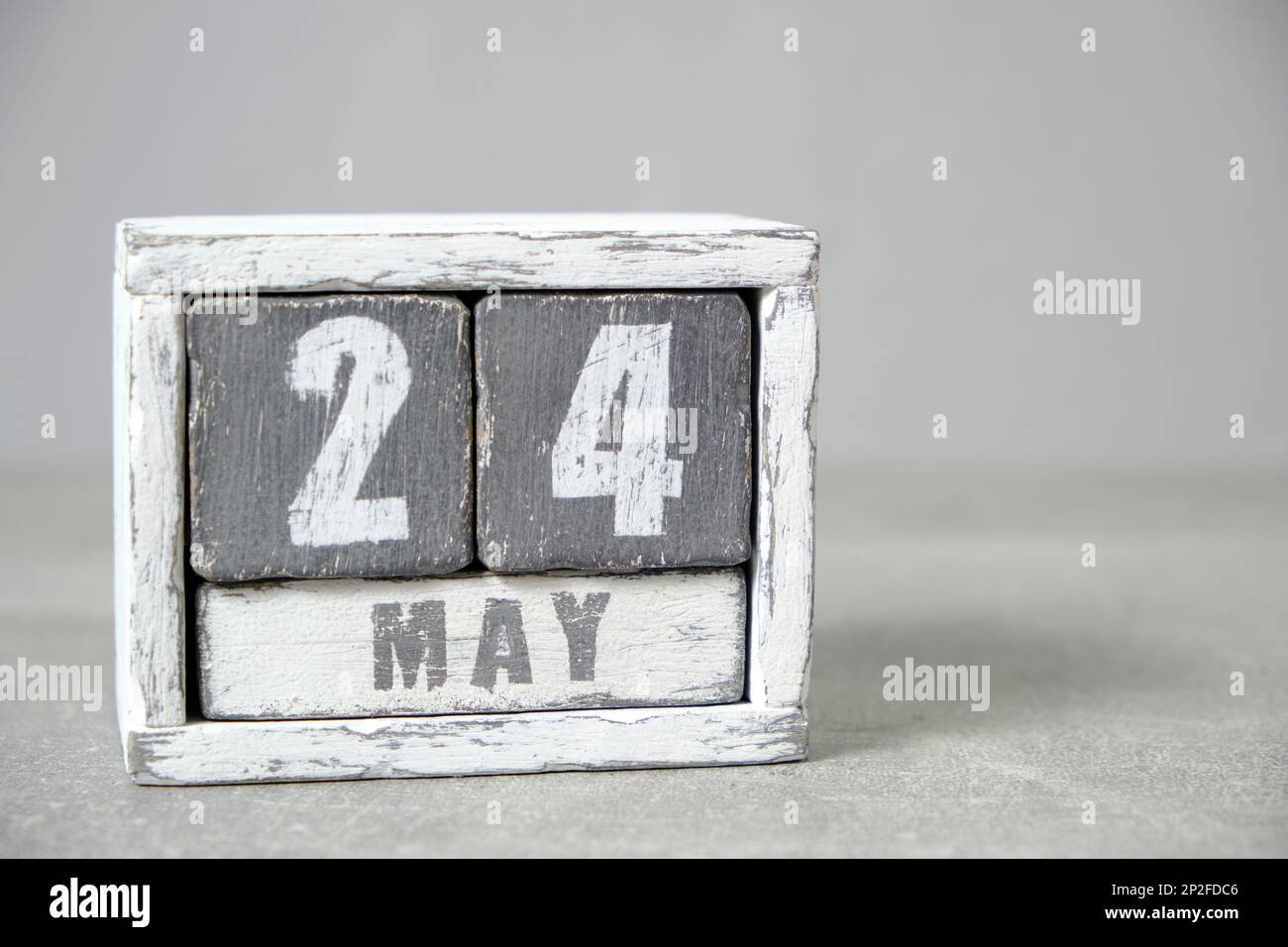 May 24 calendar made wooden cubes gray background.With an empty space ...