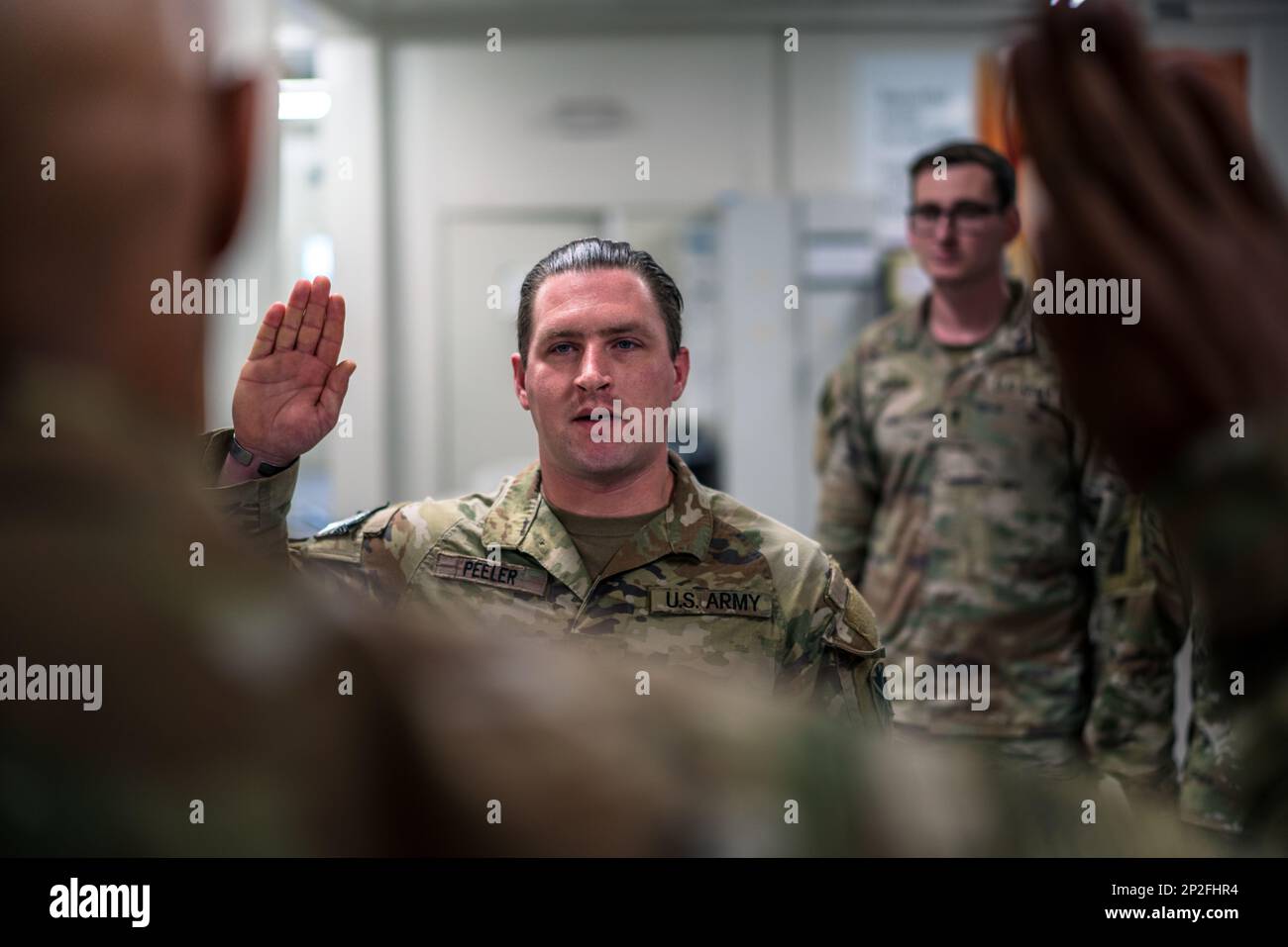 Sgt. John A. Peeler reaffirms the oath of enlistment administered by ...