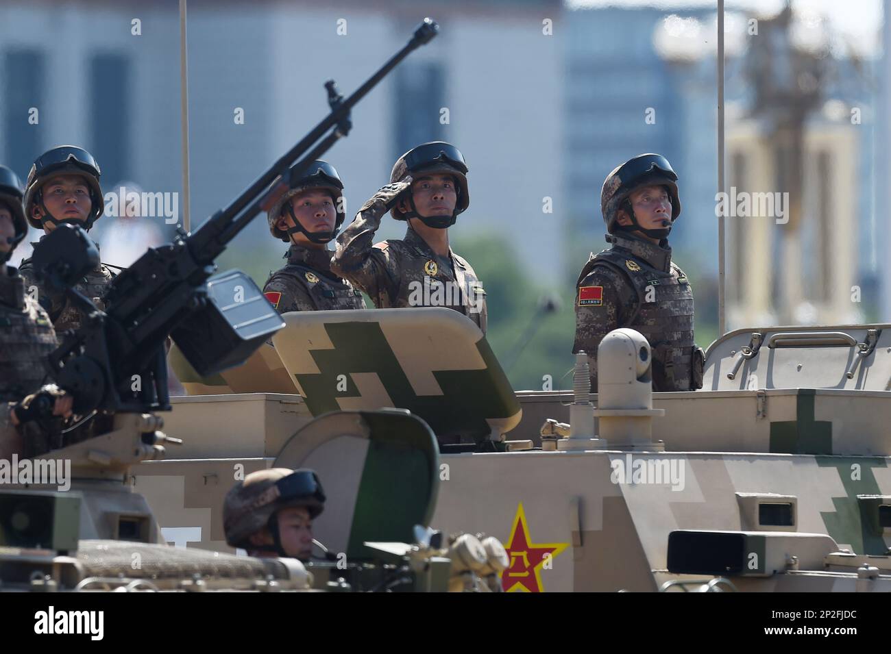 Chinese military vehicles are paraded through Tiananmen Square to mark ...