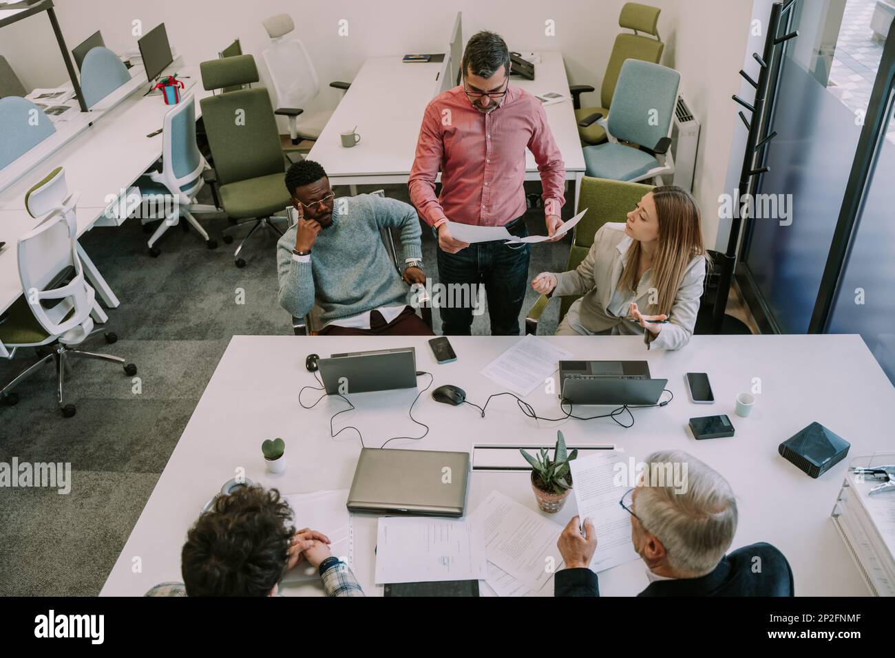 The boss telling his employees about their new job for the client at ...