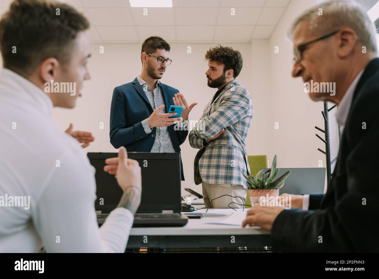 Two men stand engaged hi-res stock photography and images - Alamy