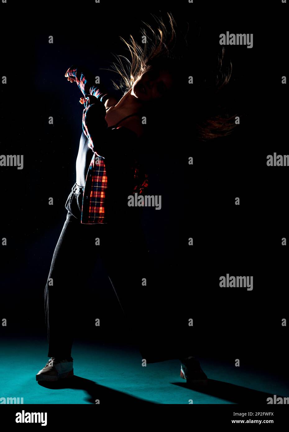 Slender flexible dance performer during a dance practice in modern ...