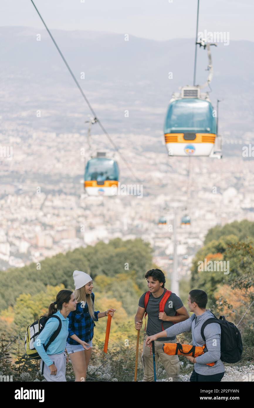 A photo of two beautiful couples standing and having a conversation ...