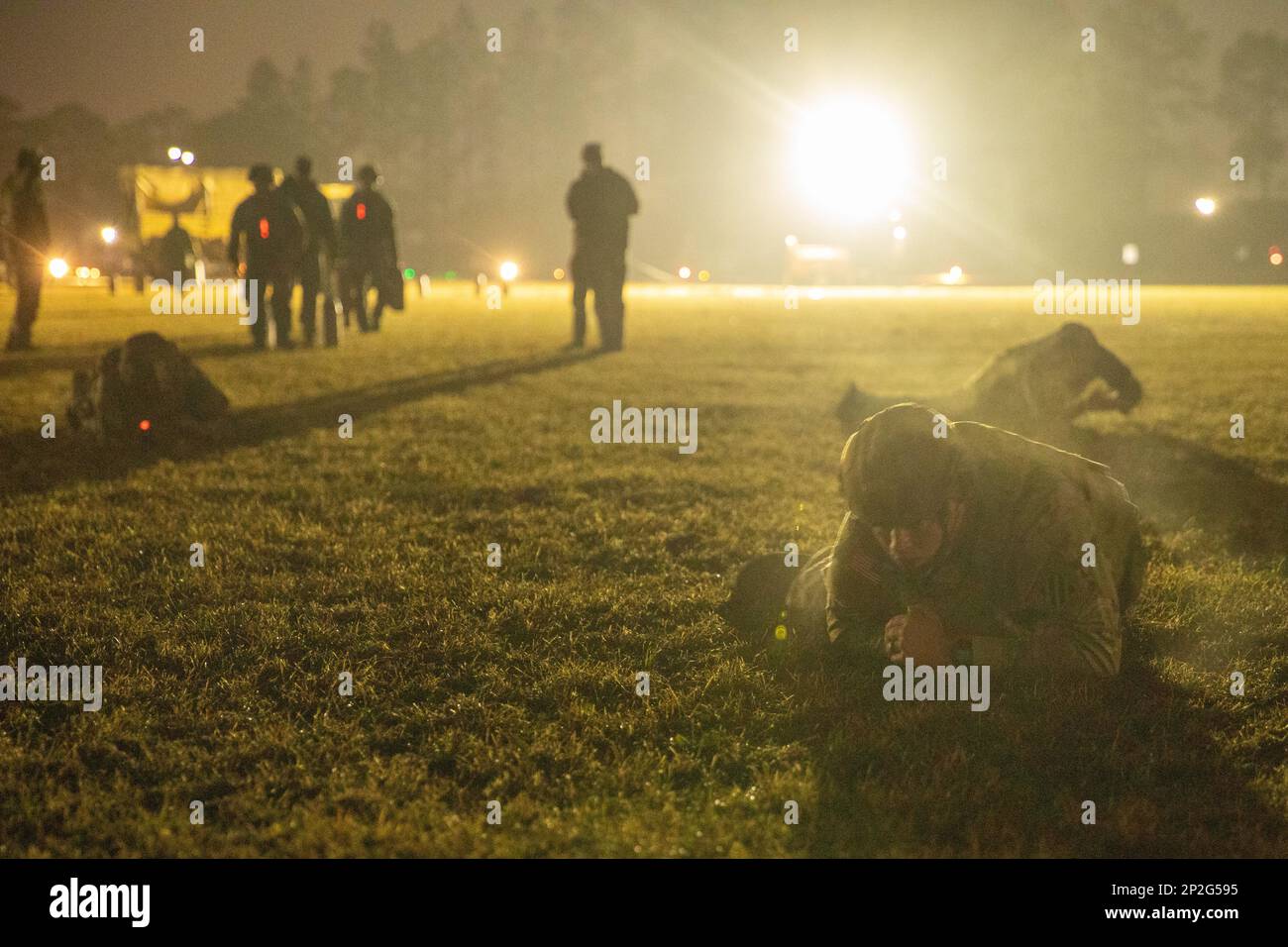 Soldiers assigned to the 3rd Infantry Divison high-crawls as part of ...