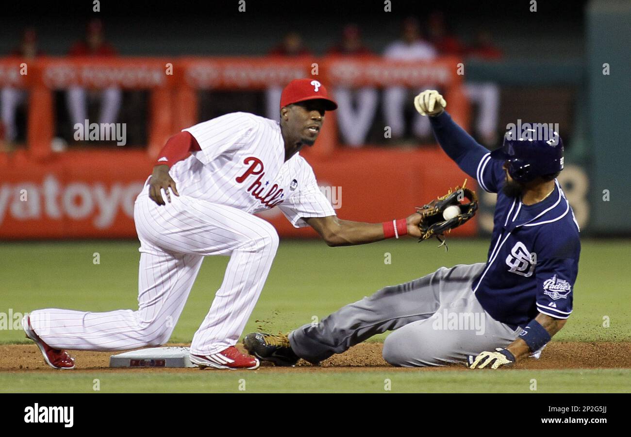 Philadelphia Phillies' Darnell Sweeney, left, is late with the tag as ...