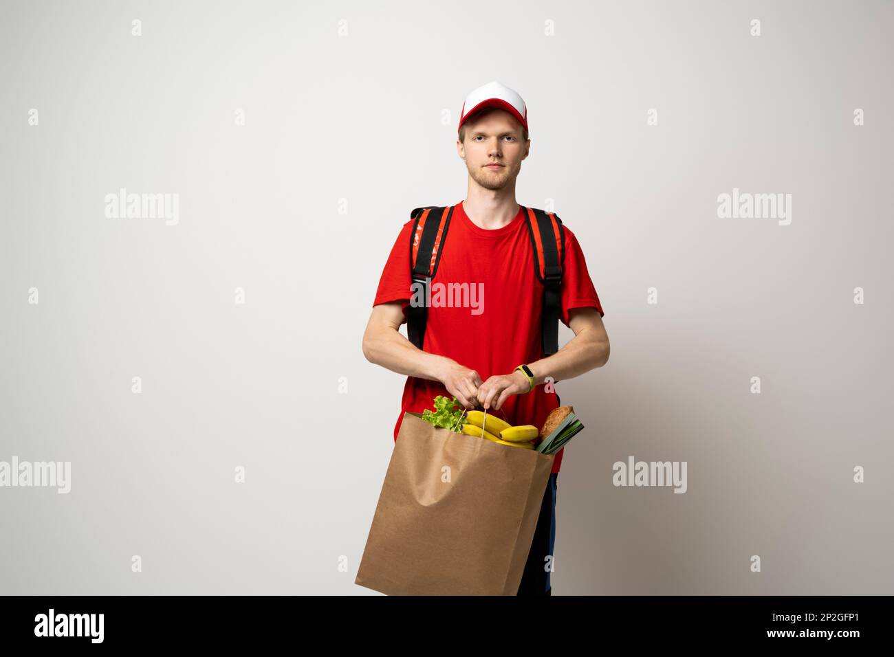 Food shipping, profession and people concept. Delivery man in red ...