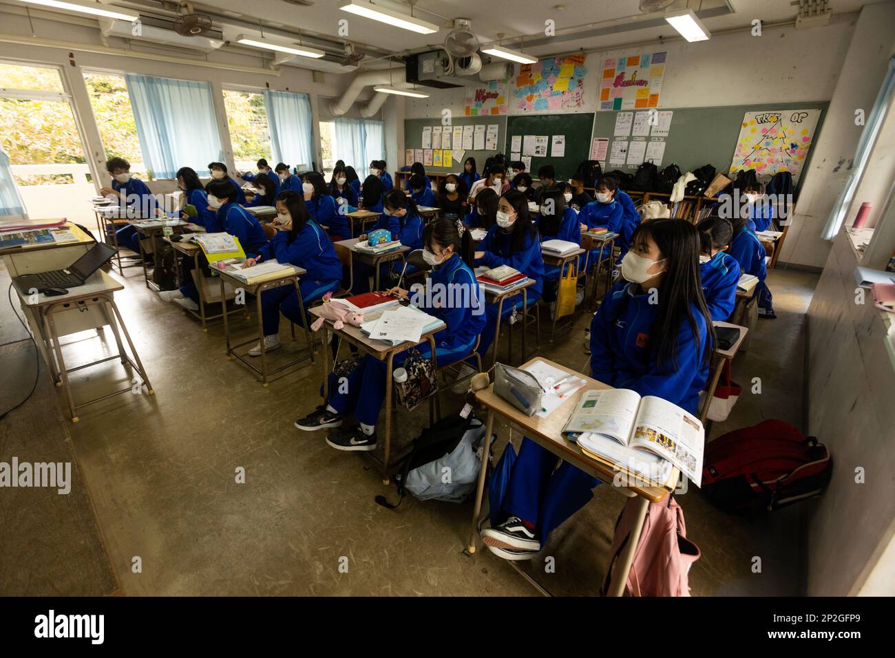American and Japanese students answer questions during an English ...
