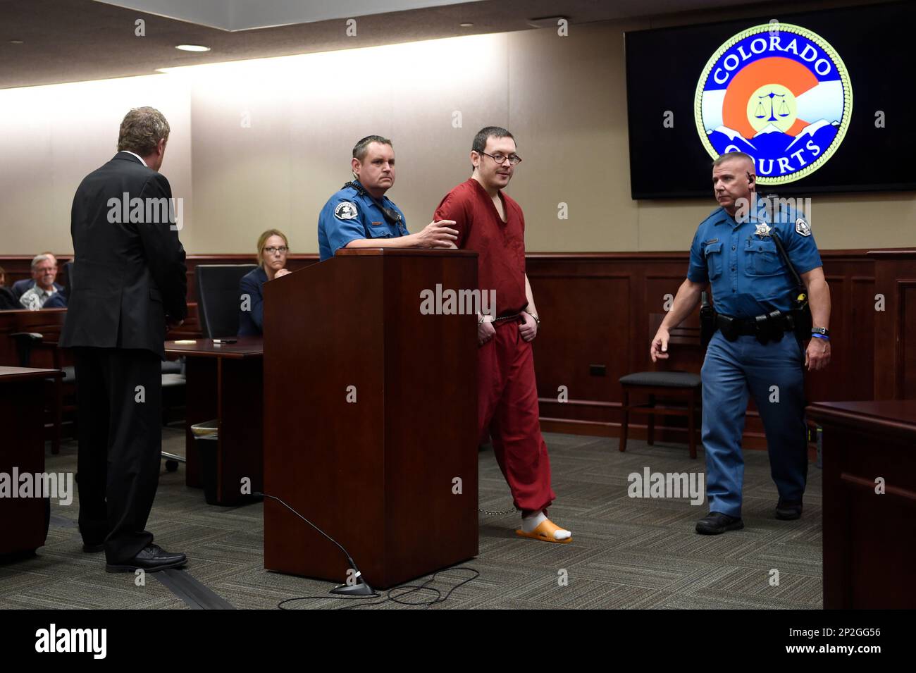 Colorado theater shooter James Holmes is led out of the courtroom after ...