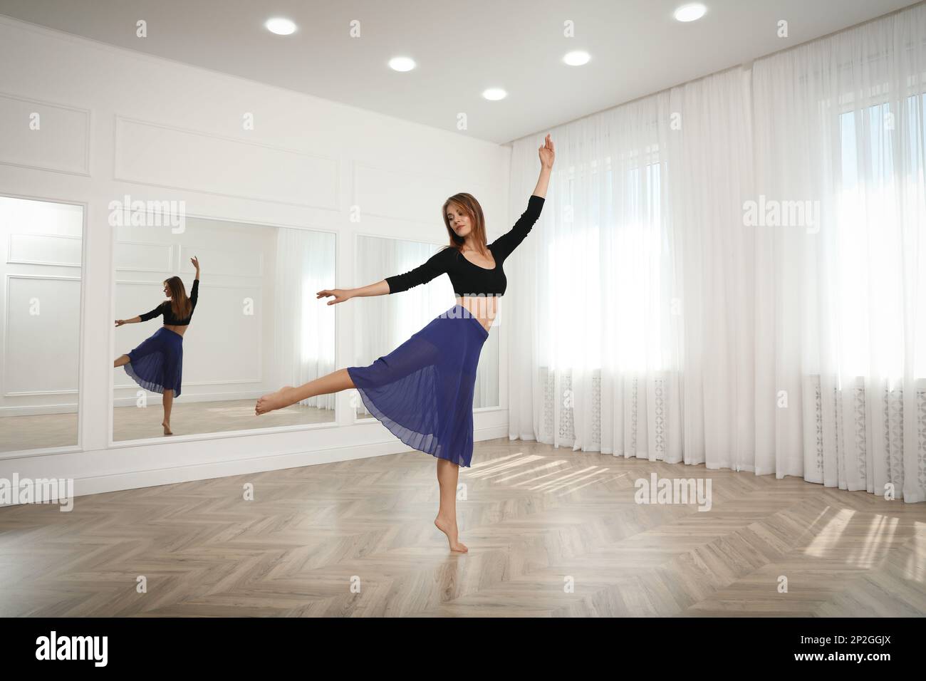 Caucasian female ballerina practicing moves hi-res stock photography ...