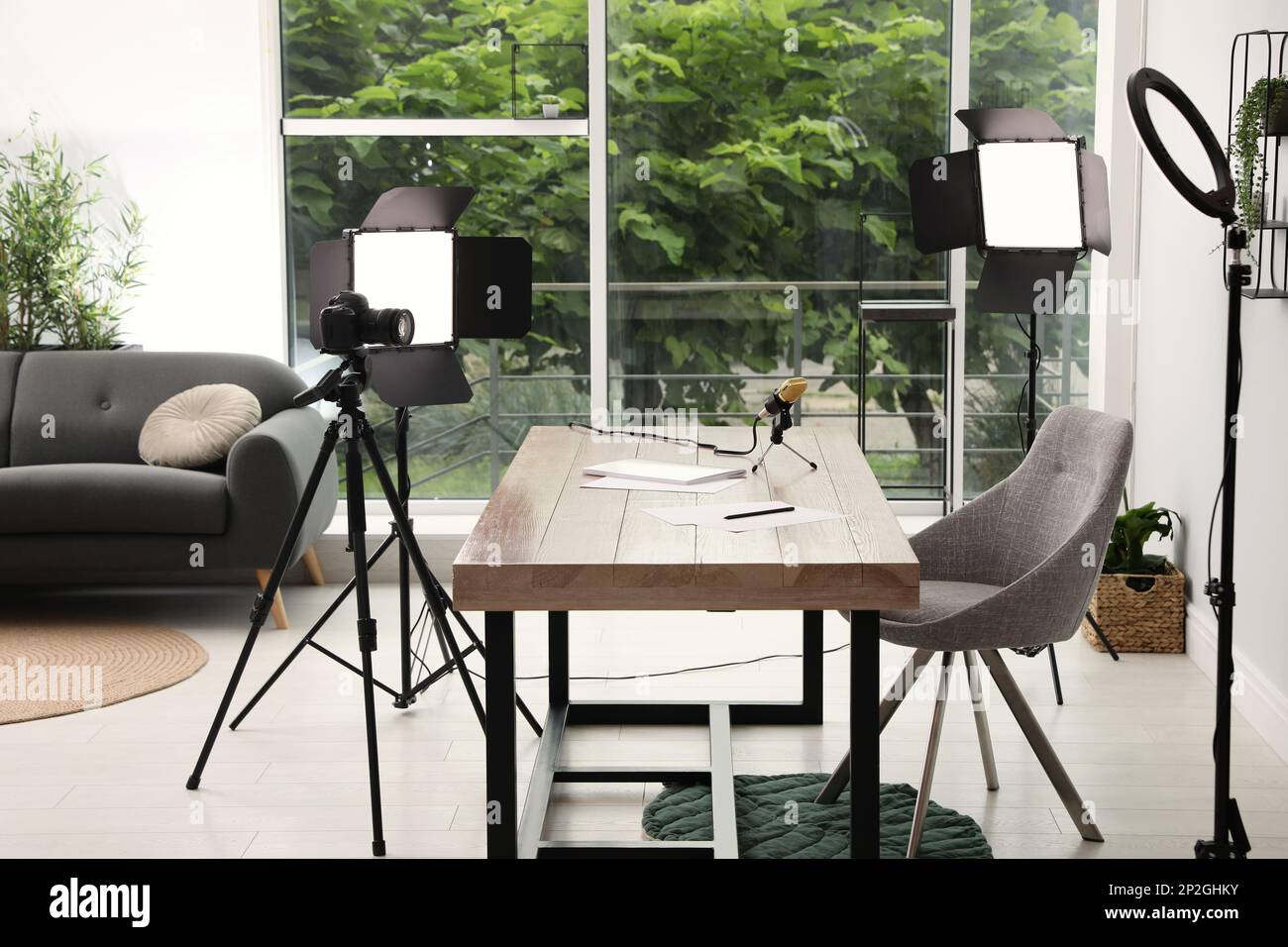 Modern blogger's workplace with professional equipment in room Stock ...