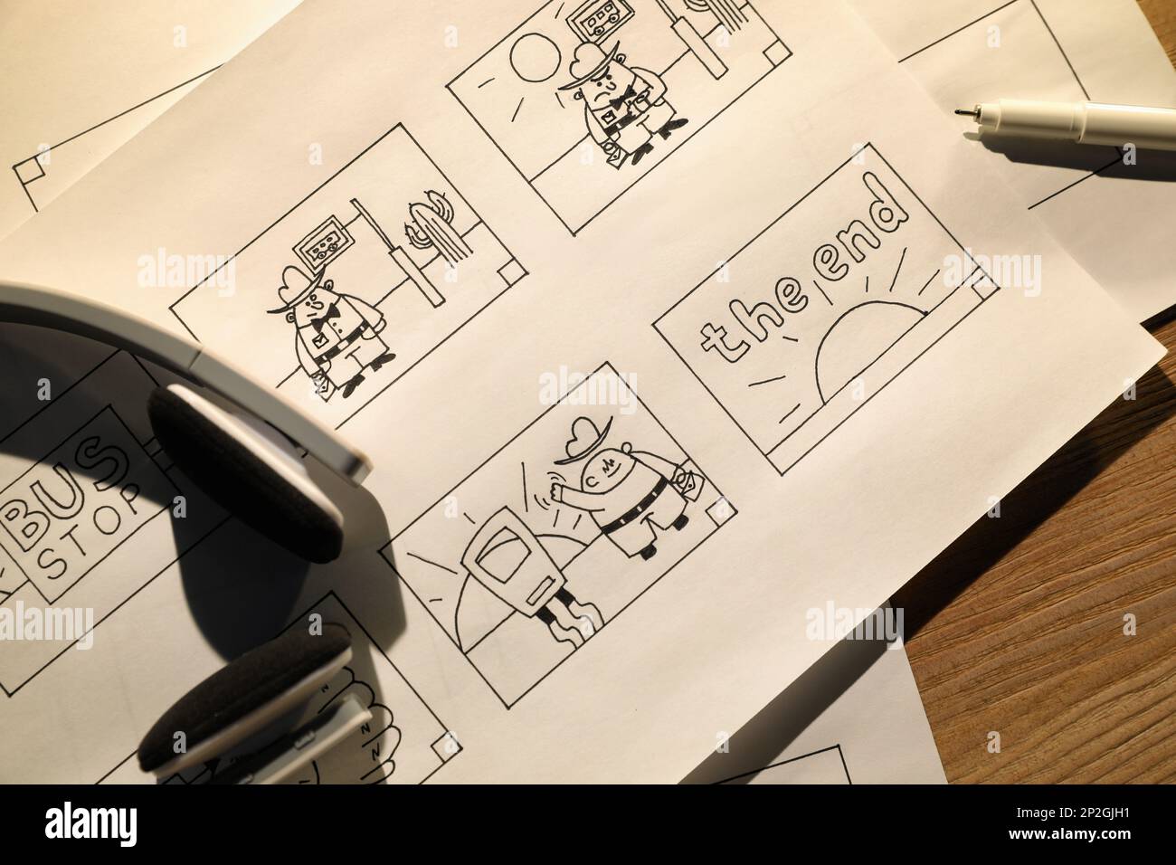 Storyboards with cartoon sketches at workplace, flat lay. Pre ...